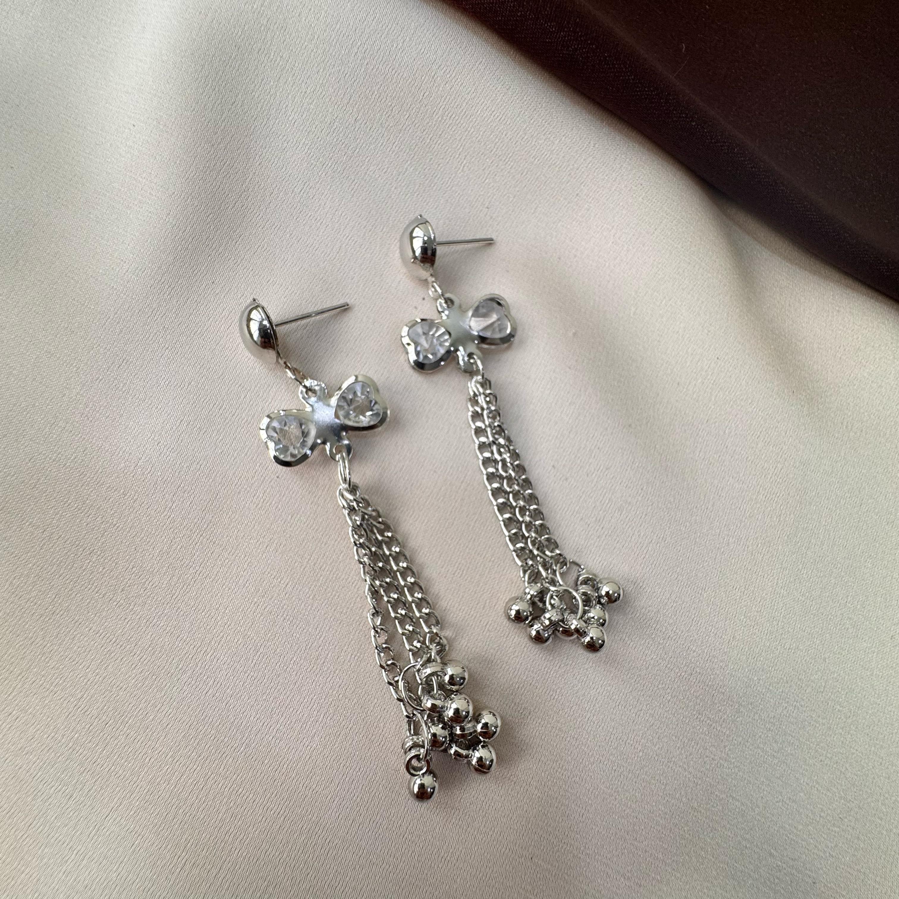 TFC Crystal Bow Silver Plated Dangler Earrings